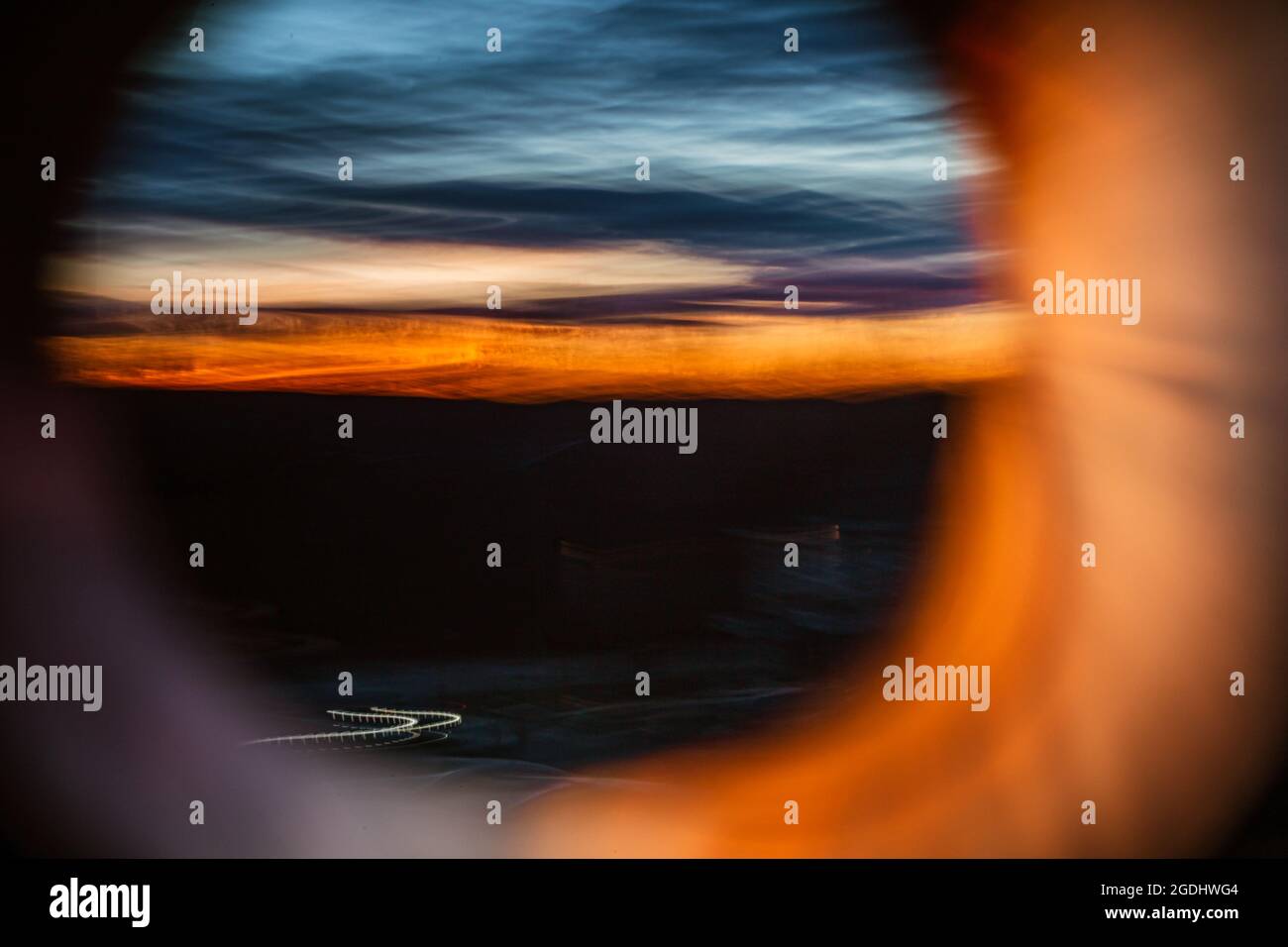 abstract sunset over a neighborhood with car light trail Stock Photo ...