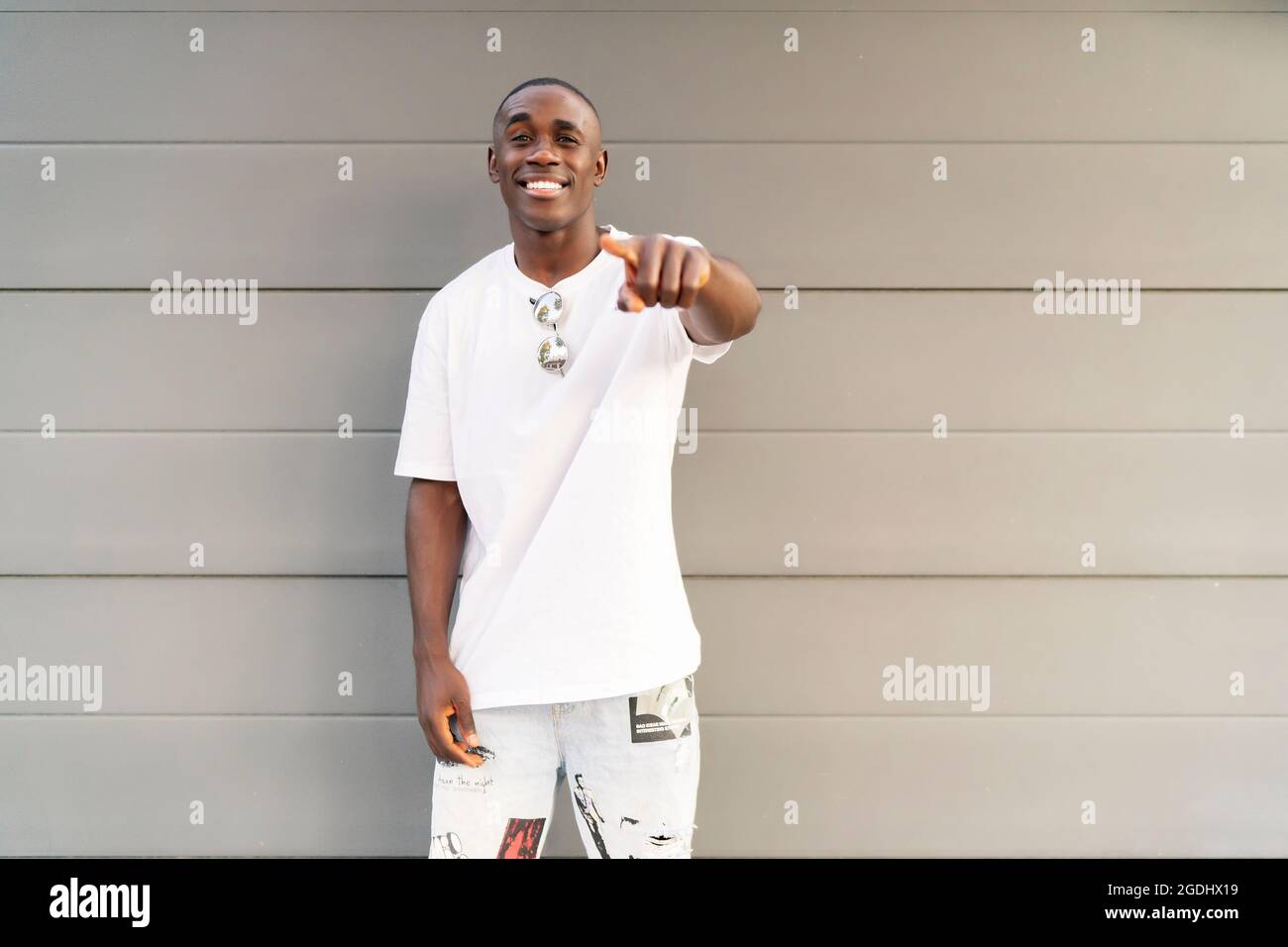 portrait of young man of color smiling at camera Stock Photo - Alamy