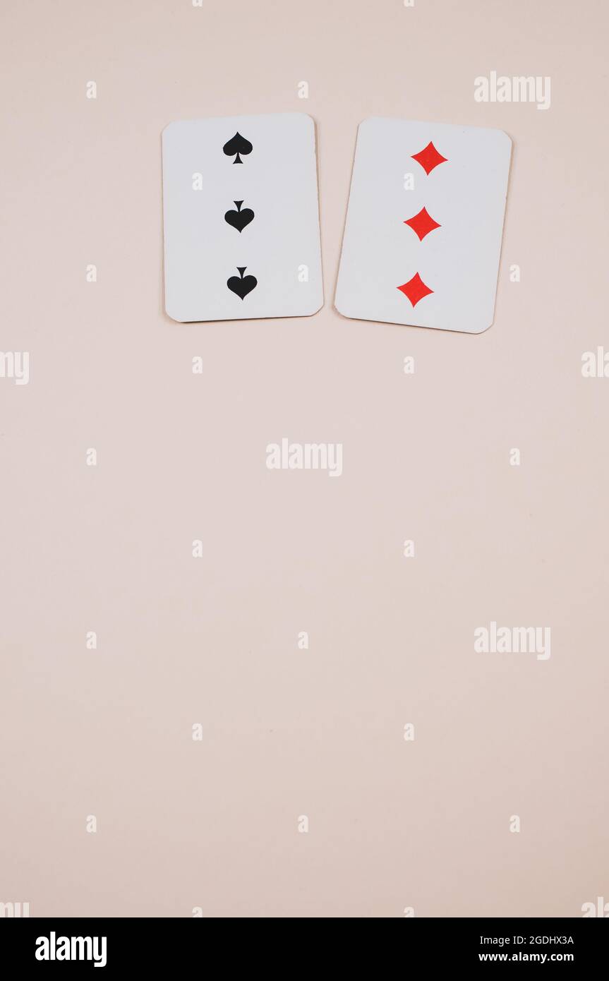 Vertical shot of cards for a game in a coral background Stock Photo - Alamy