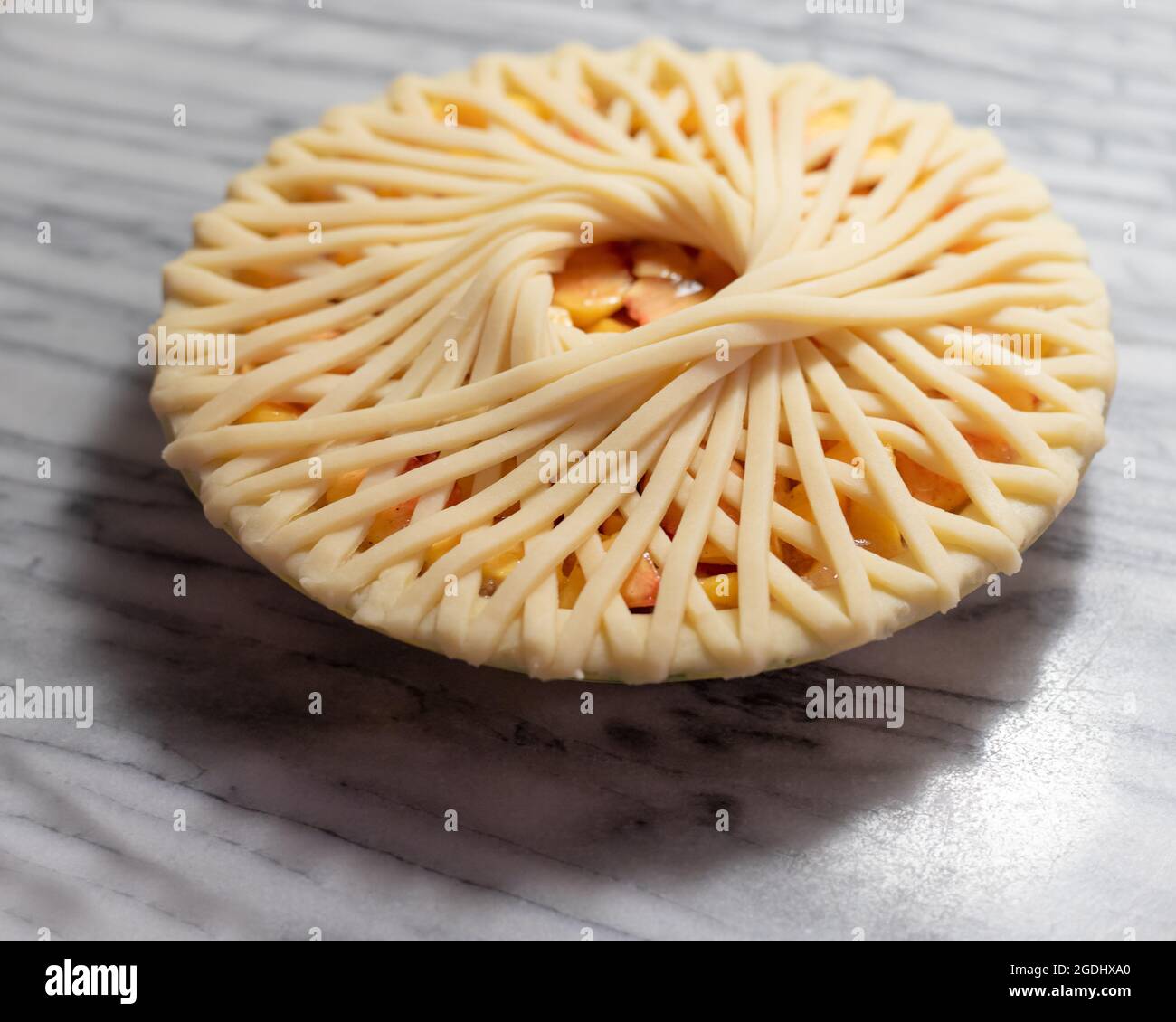 peach pie with spiral lattice on white marble Stock Photo - Alamy