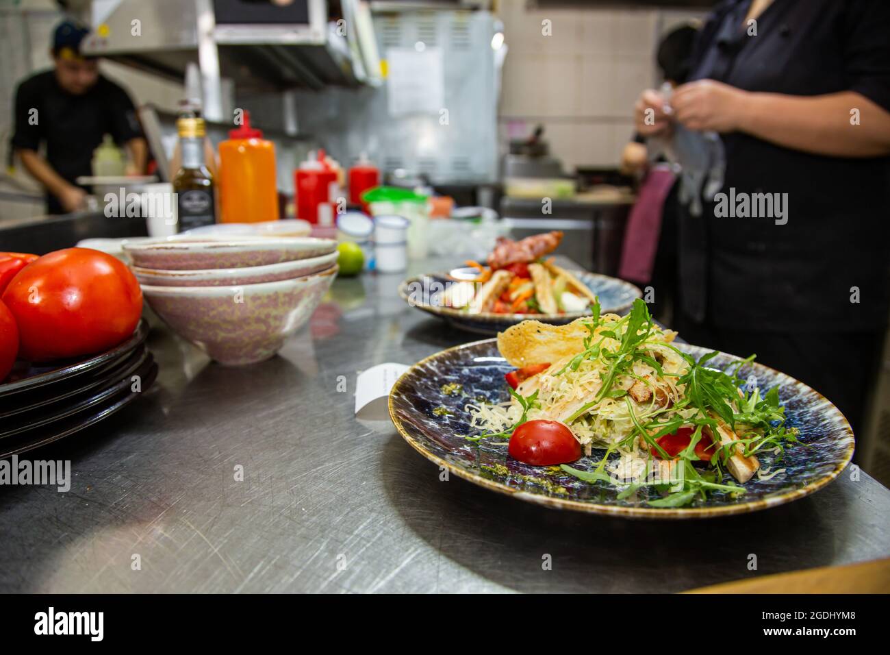Professional chef cooking in the kitchen restaurant at the hotel ...