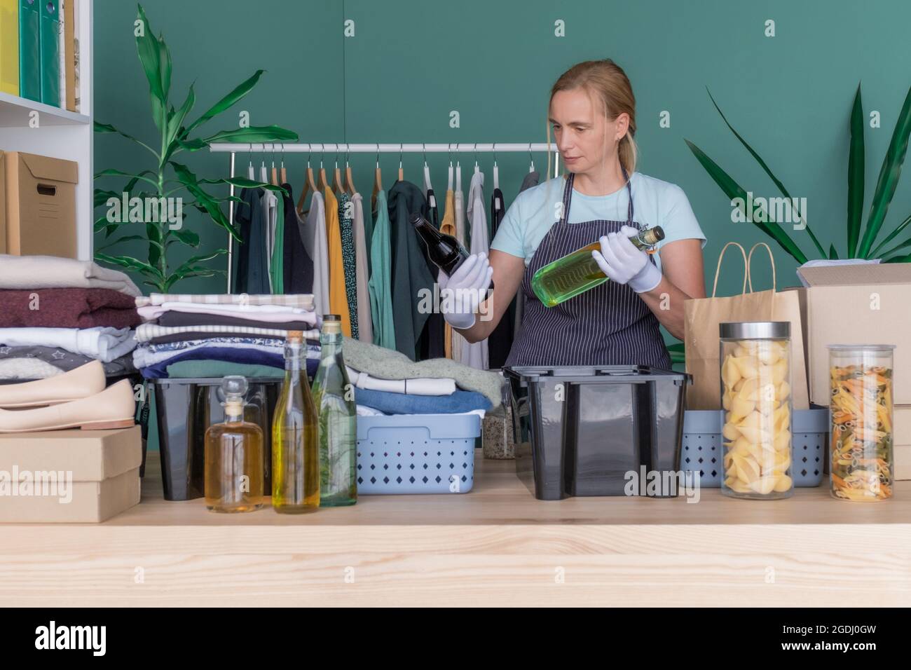 Woman packs donation box hi-res stock photography and images - Alamy