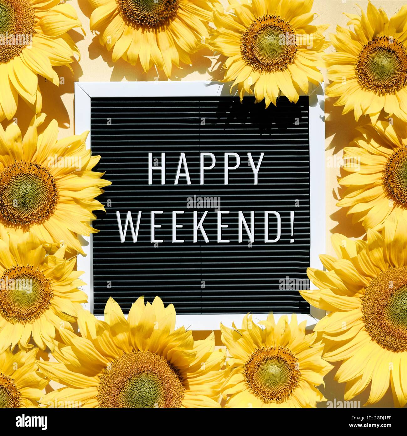 Happy Weekend, text on letter board with sunflowers. Flat lay with ...