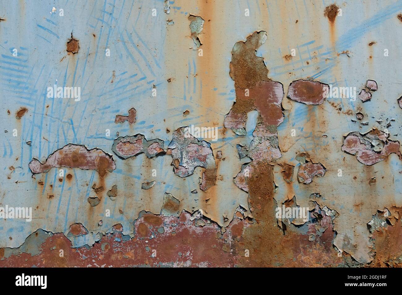 On a blue metal wall the traces of rust form a map Stock Photo - Alamy