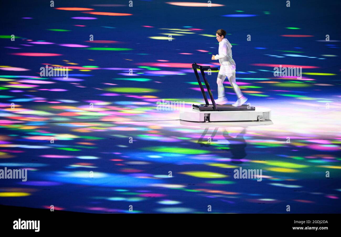 Choreography with Japanese dancers, actors, young man on a treadmill ...