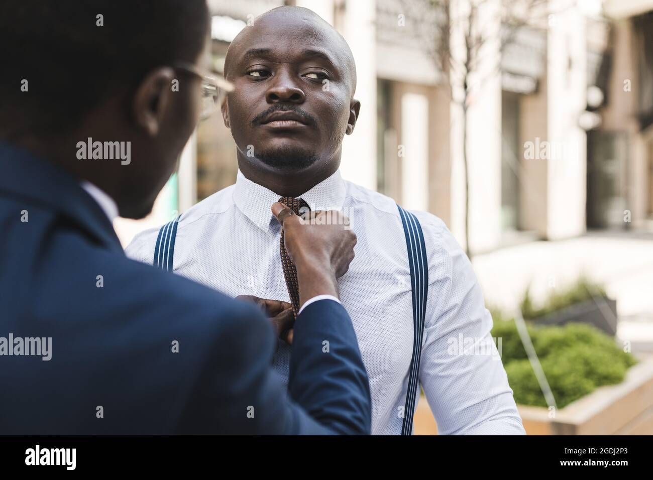 Two black African American businessman friends before an important ...
