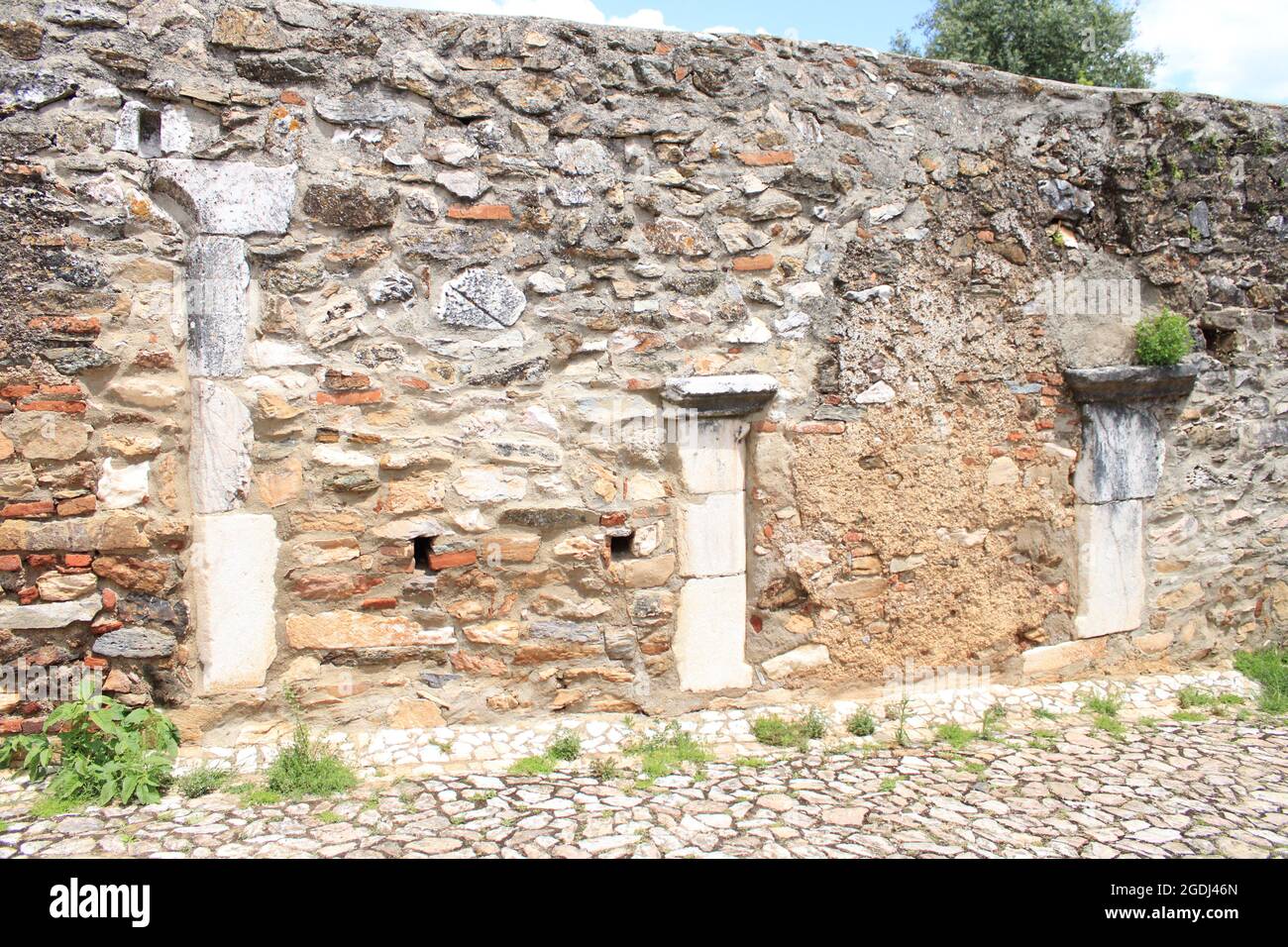 Closeup of the wall of a ruins with old columns Stock Photo - Alamy