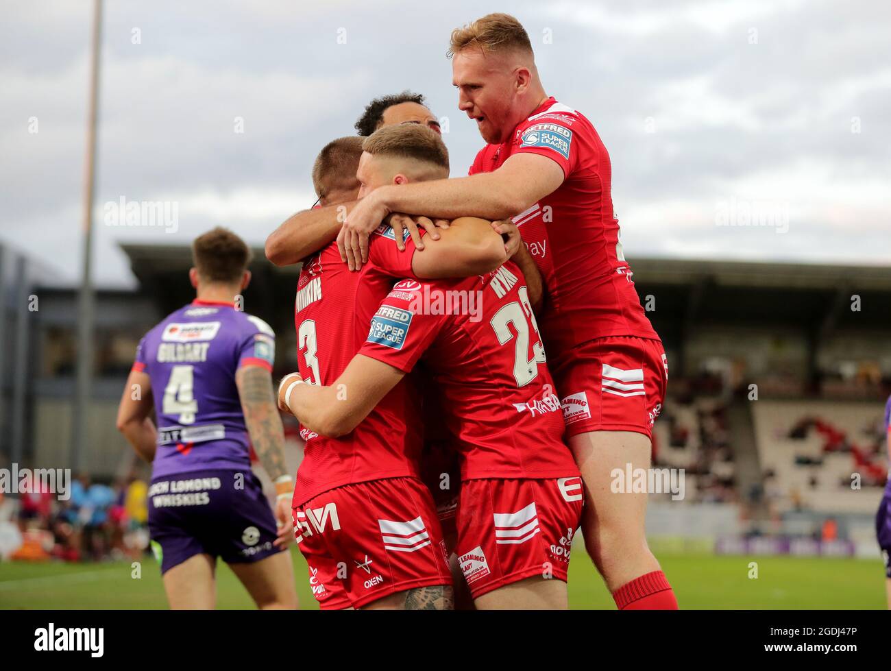 Hull Kr's Ethan Ryan is mobbed after he scores during the Betfred Super ...