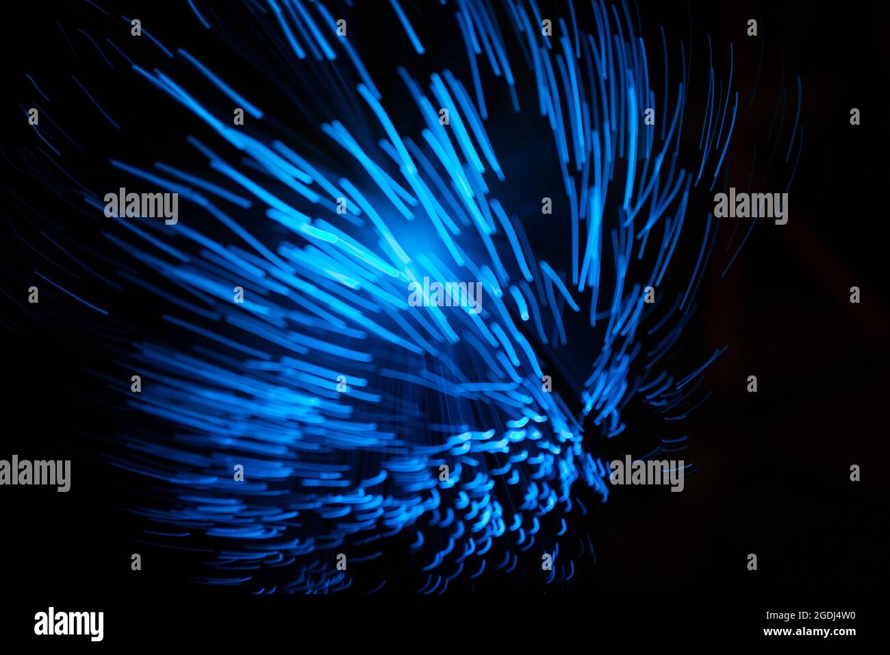 Blue abstract particles and lines with bokeh and blur in dark ...