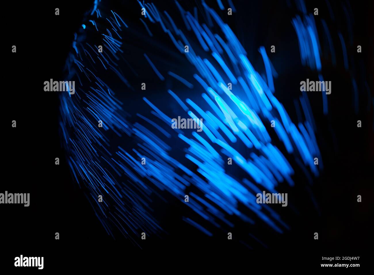 Blue abstract particles and lines with bokeh and blur in dark ...