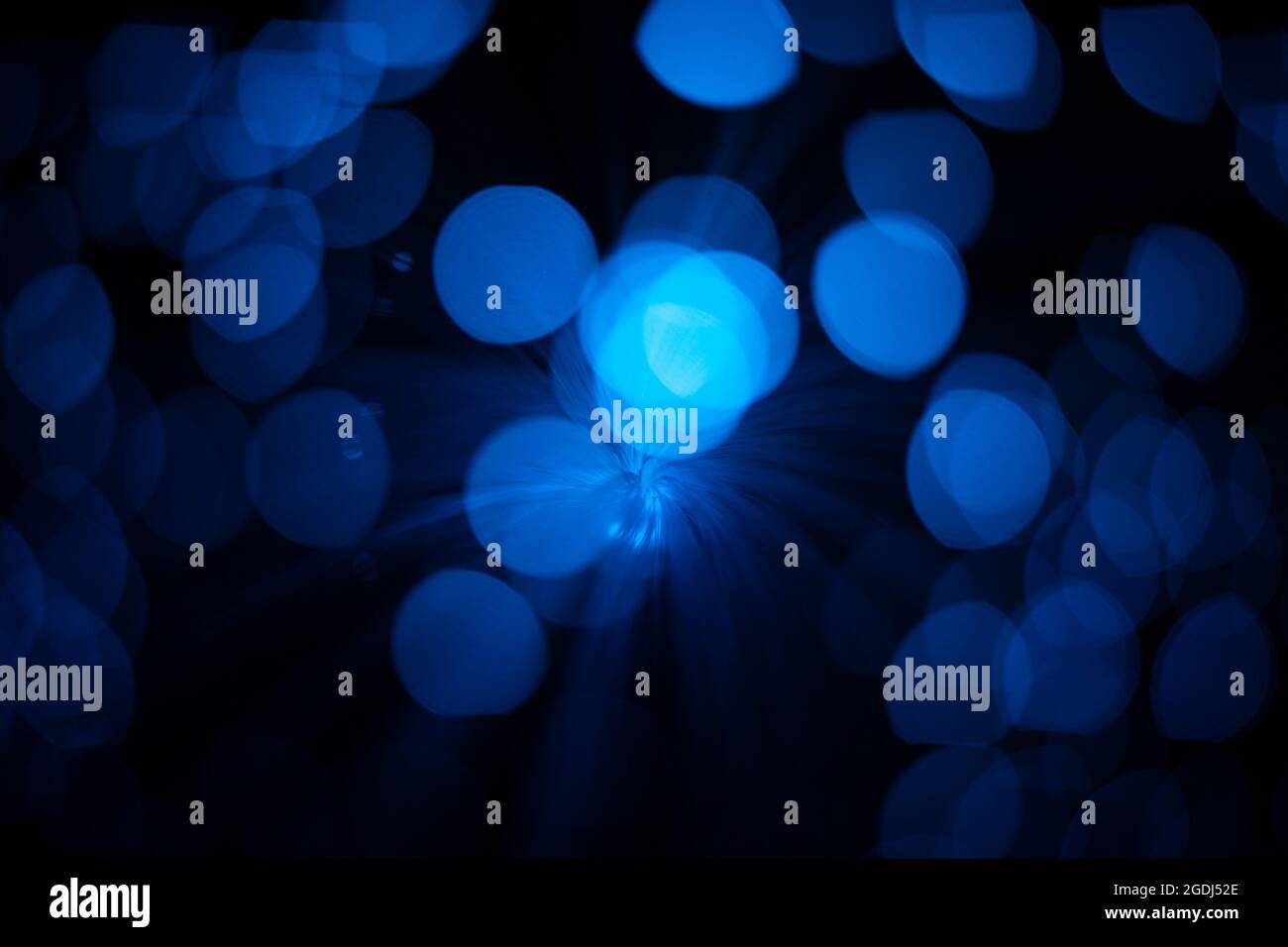 Blue abstract particles and lines with bokeh and blur in dark ...