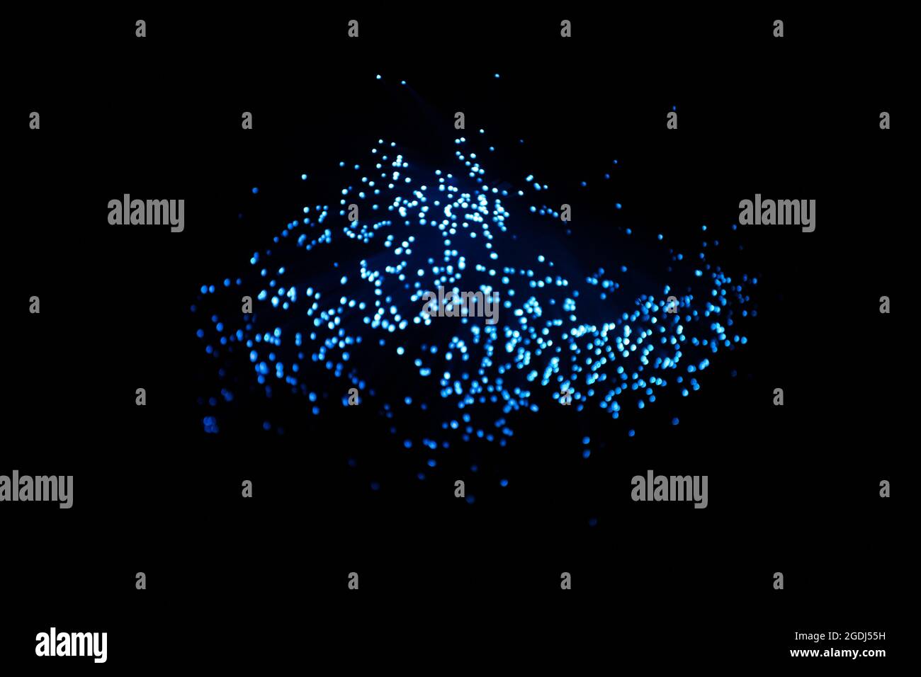 Blue abstract particles and lines with bokeh and blur in dark ...