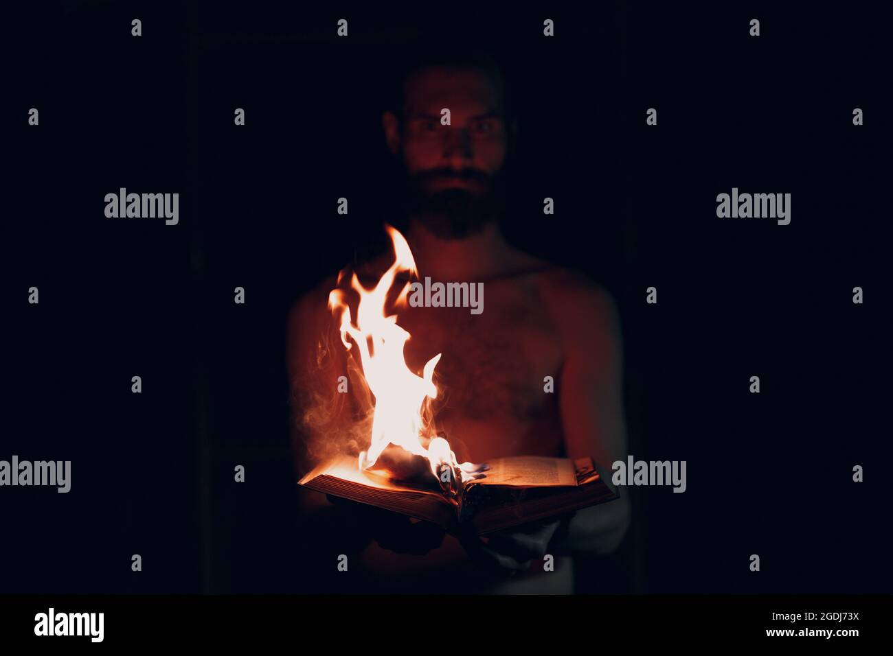 Burning book cover hi-res stock photography and images - Alamy