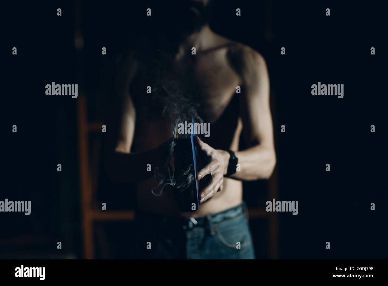 Man hold burning book in his hands Stock Photo - Alamy