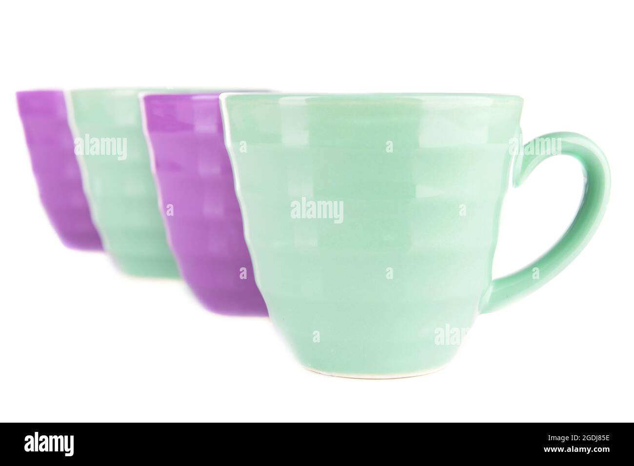 Bright cups isolated on white Stock Photo - Alamy