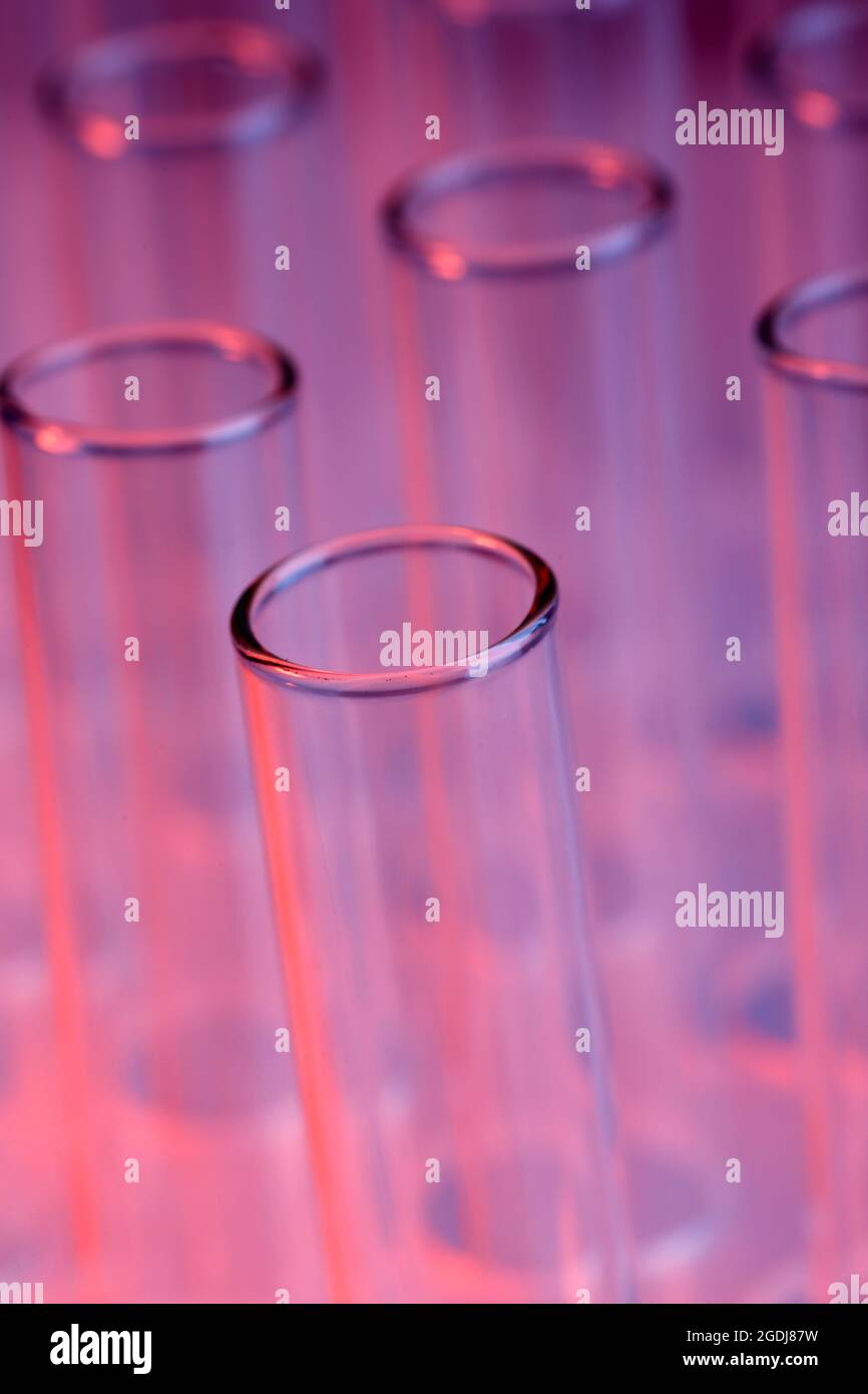 Empty test-tubes with on purple background Stock Photo - Alamy