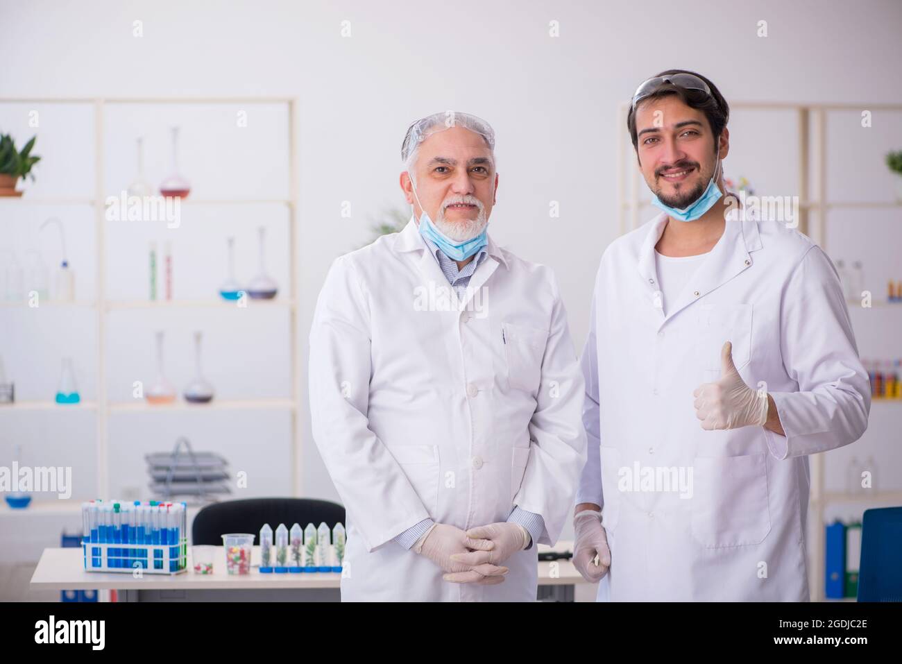 Two chemists in drugs synthesis concept at the lab Stock Photo - Alamy