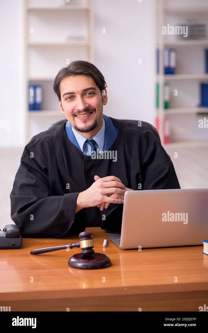 Young judge working in the courtroom Stock Photo - Alamy