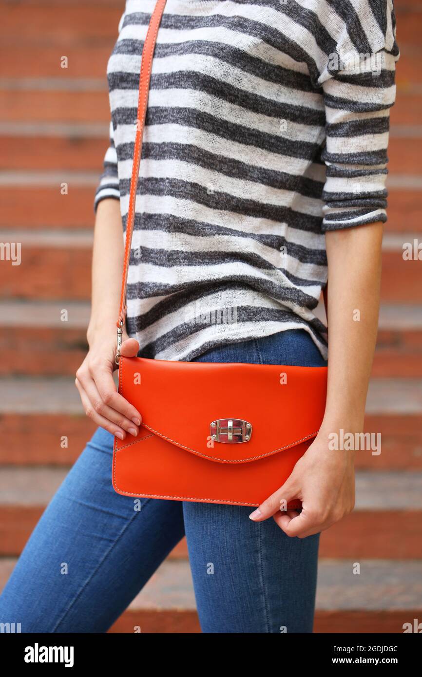 Girl with bag over his shoulder outdoors Stock Photo - Alamy