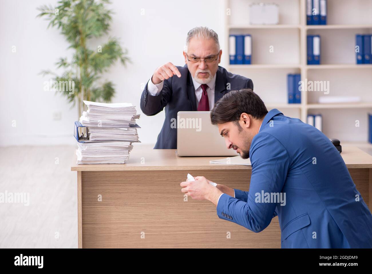 Two employees in dismissal concept Stock Photo - Alamy