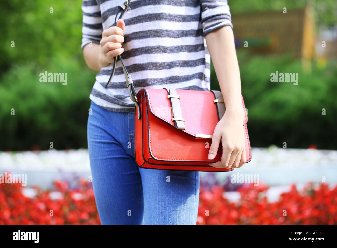 Girl with bag over his shoulder outdoors Stock Photo - Alamy