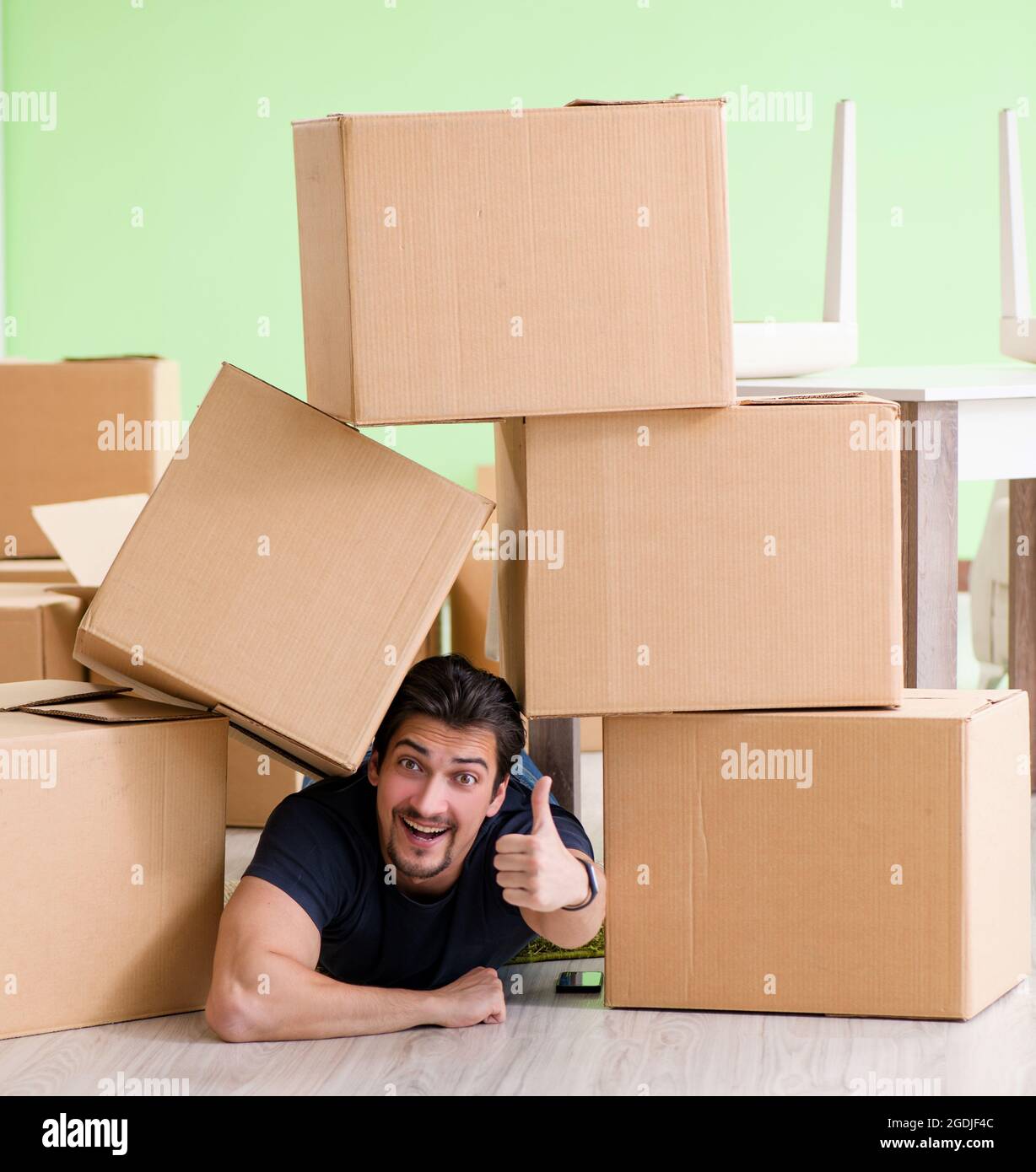 The man moving house with boxes Stock Photo - Alamy