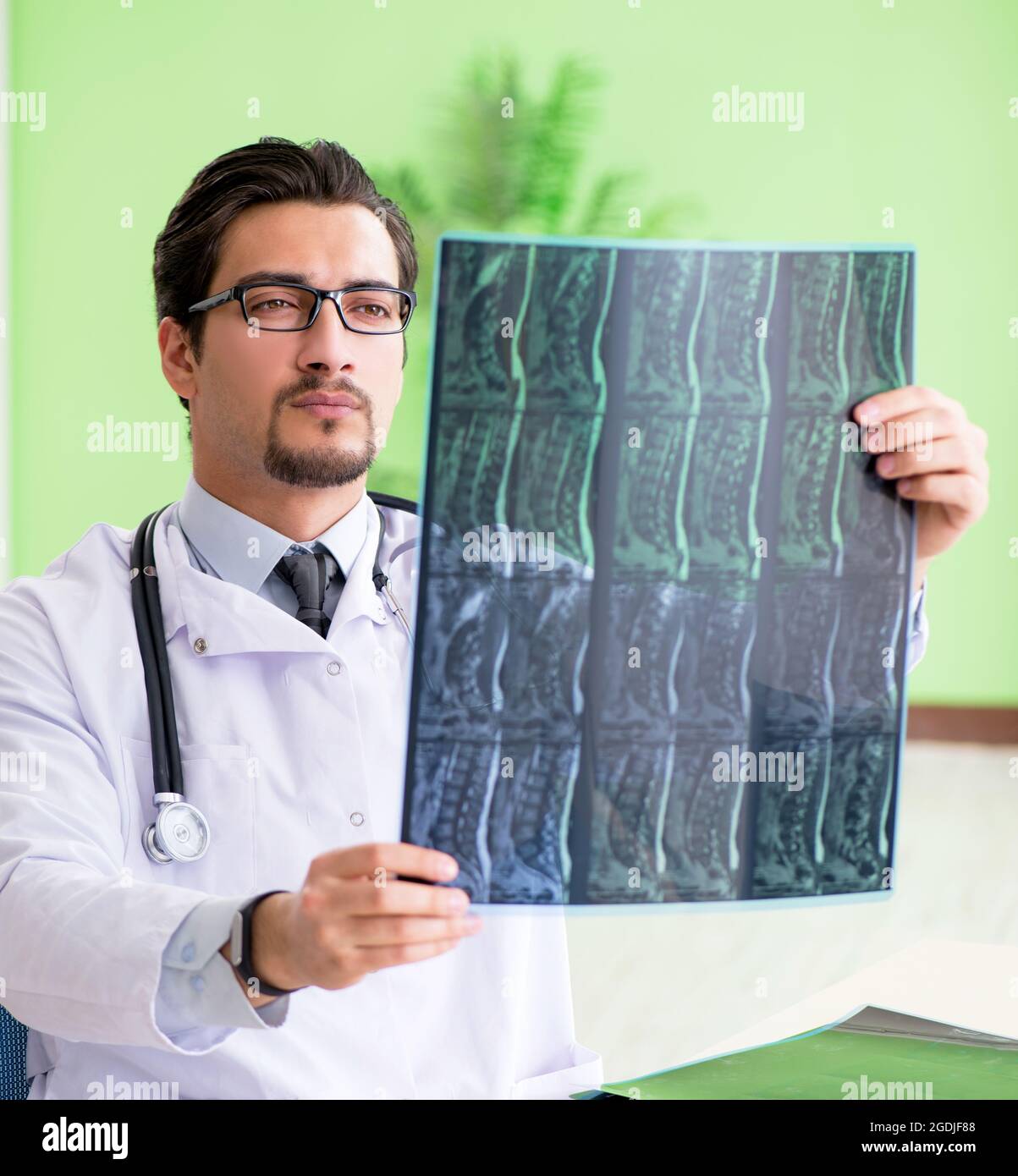 The doctor radiologist looking at x-ray scan in hospital Stock Photo ...