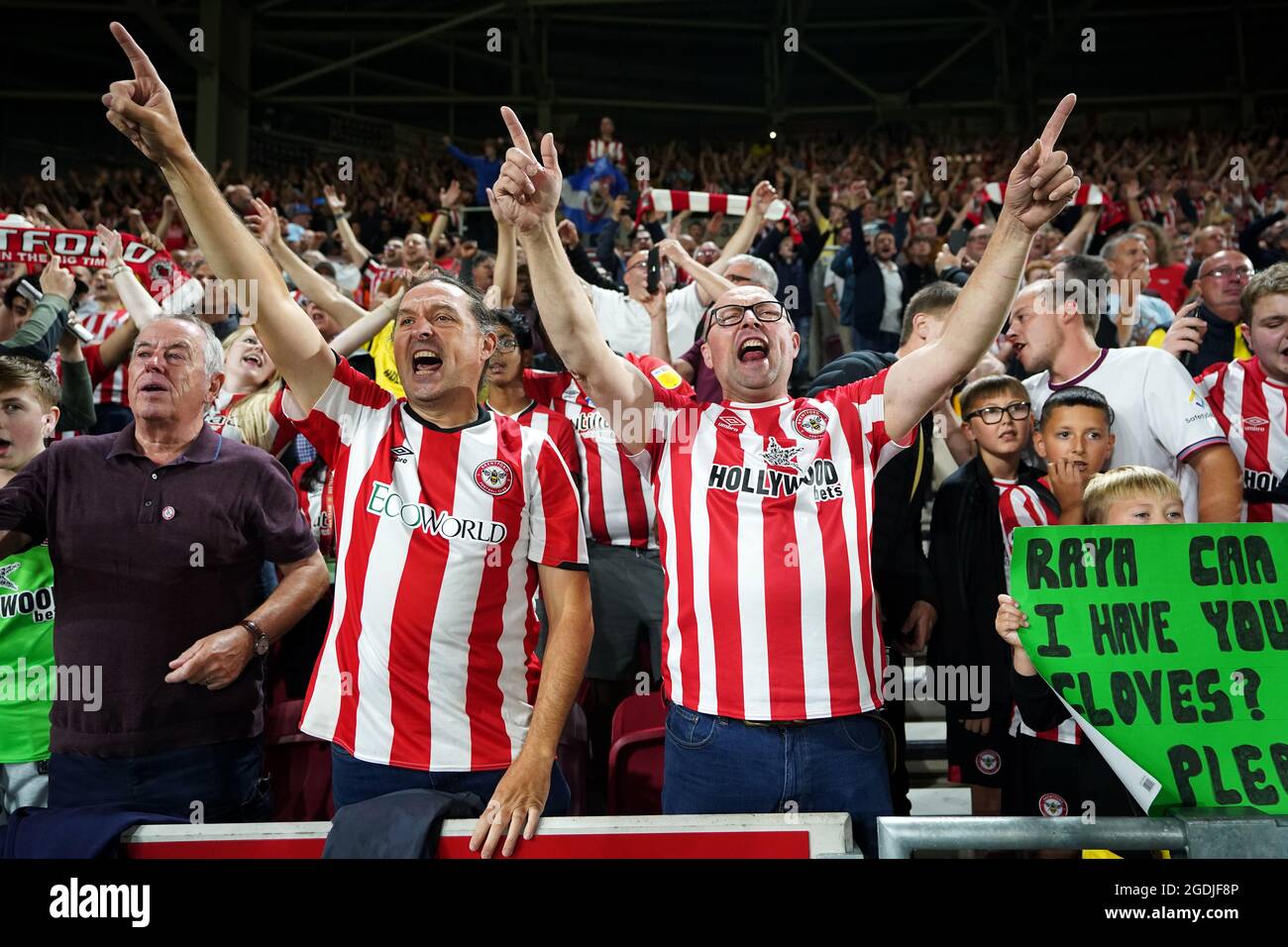 Brentford fans in the stands celebrate after the final whistle during ...