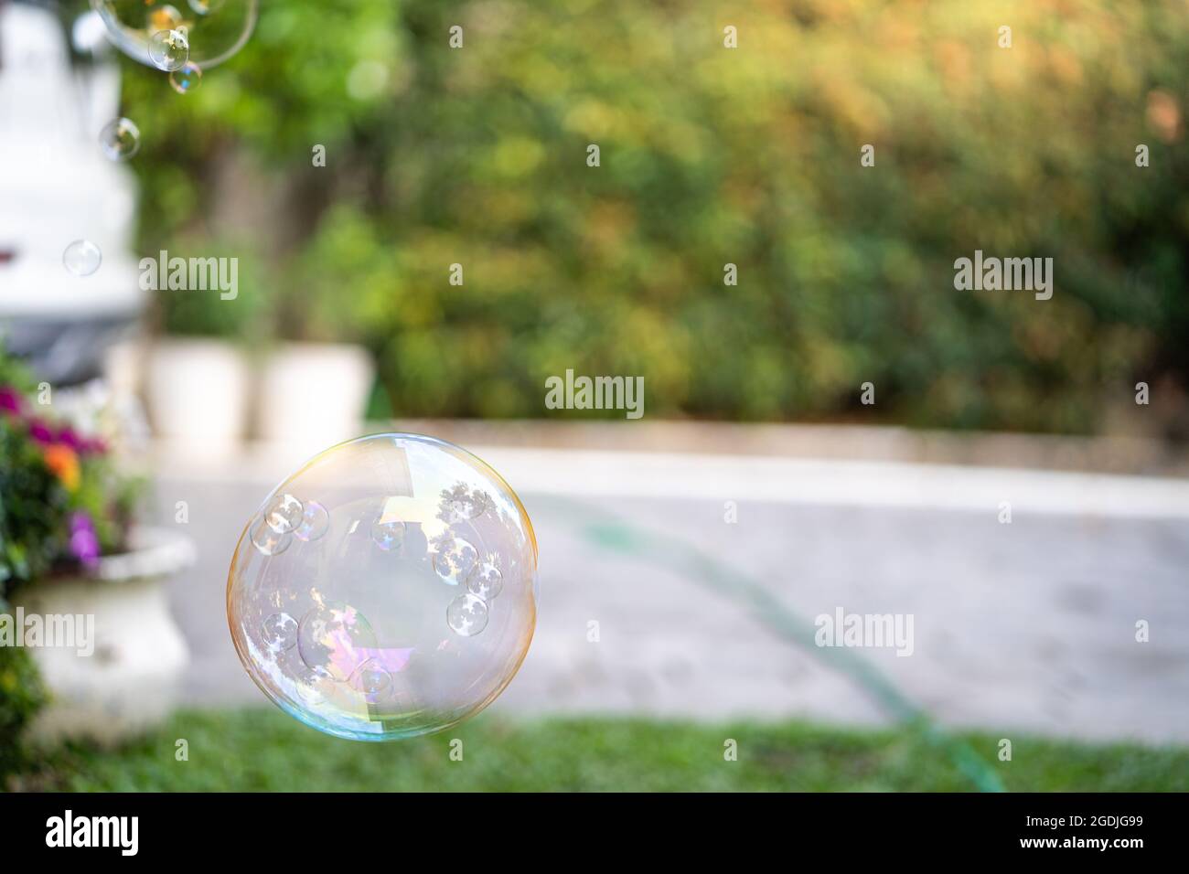 Soap bubble floating in the air Stock Photo - Alamy