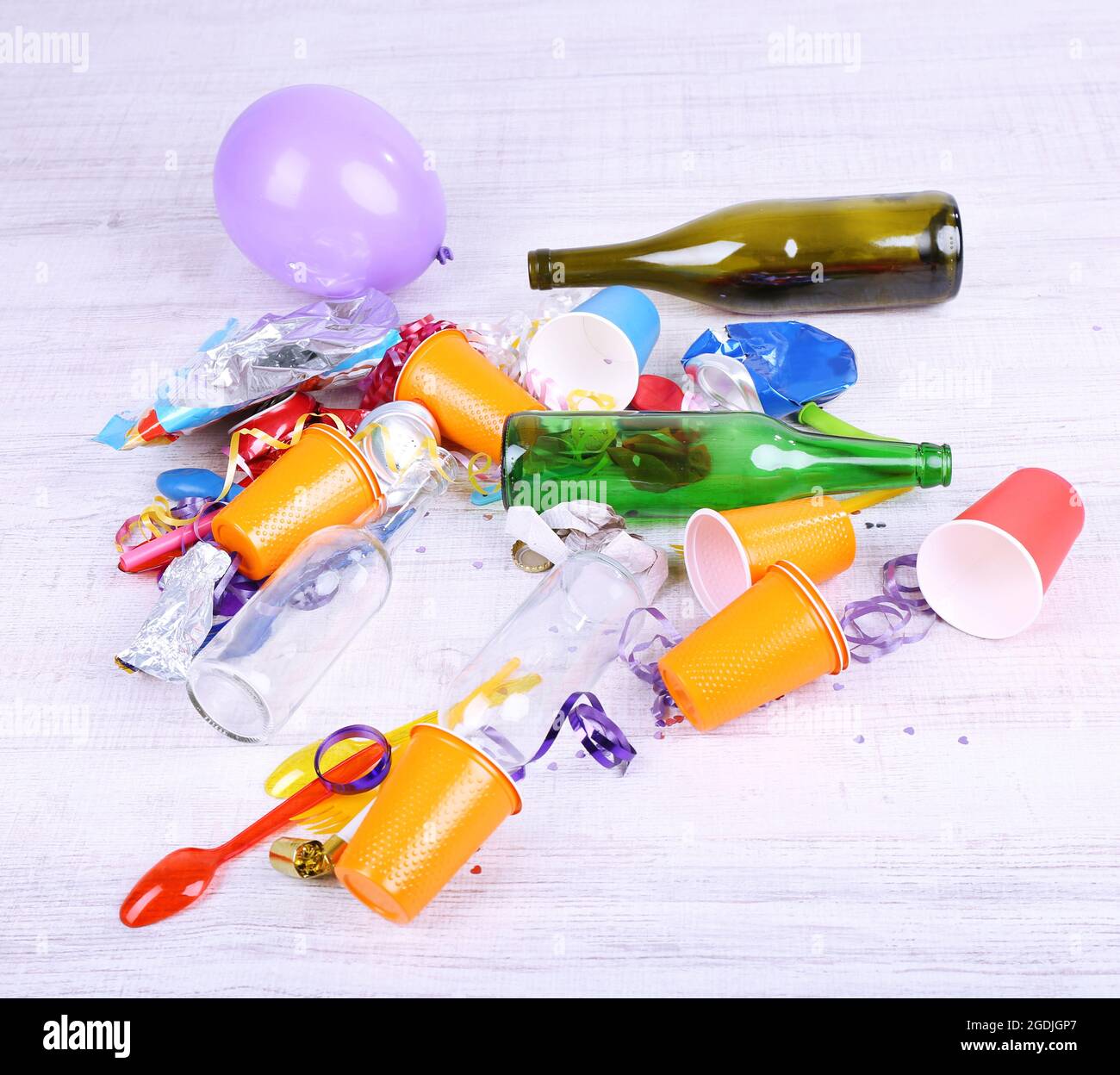 Heap of mess on grey wooden floor Stock Photo - Alamy