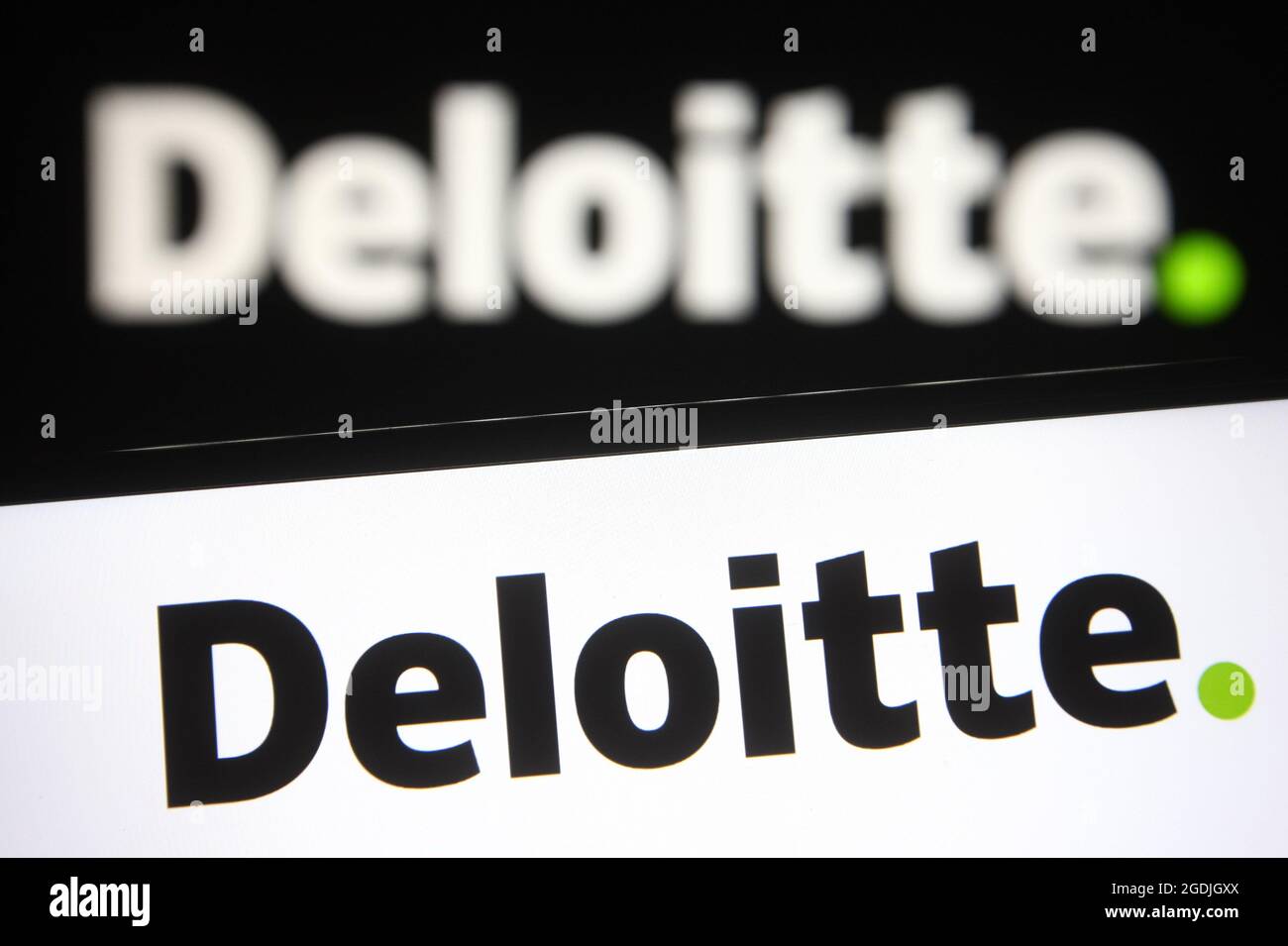 In this photo illustration a Deloitte (Deloitte Touche Tohmatsu Limited ...