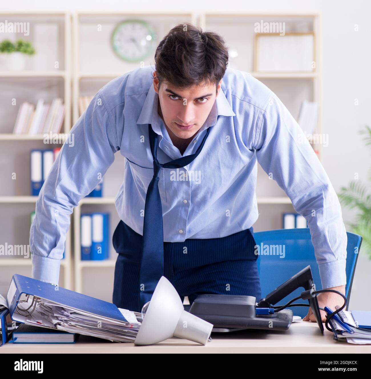 The angry businessman frustrated with too much work Stock Photo - Alamy