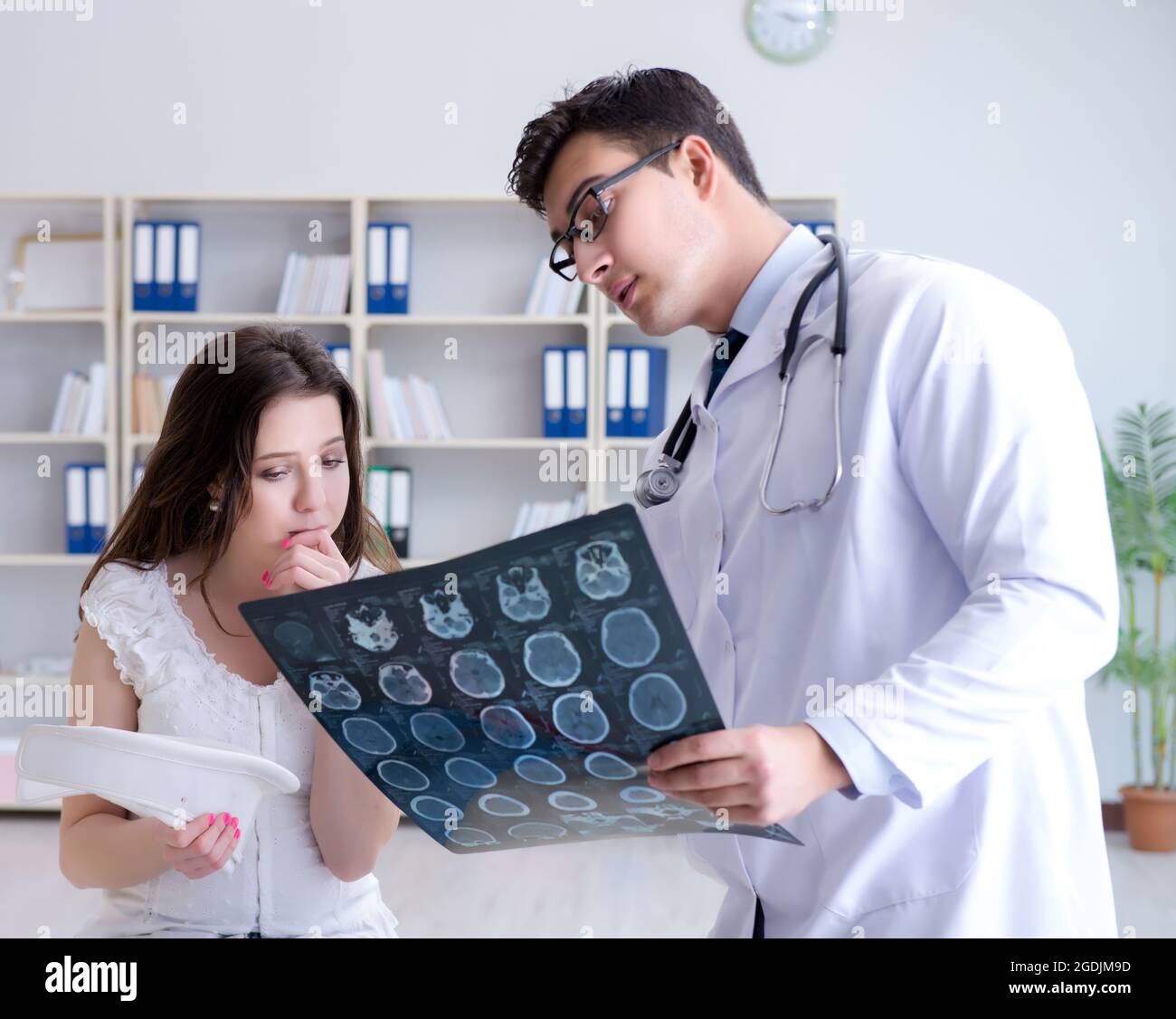 Woman doctor explaining neck xray hi-res stock photography and images ...