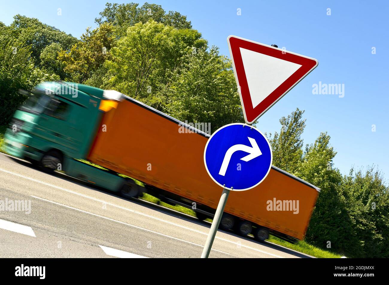 traffic sign: give way and turn right , Germany Stock Photo - Alamy