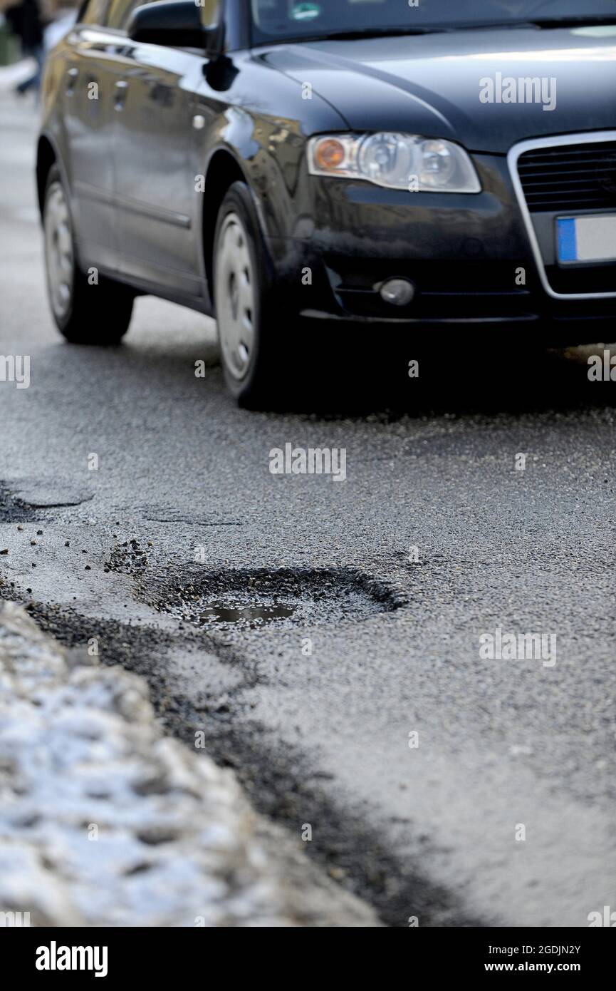 road with potholes after cold winter , Germany Stock Photo - Alamy
