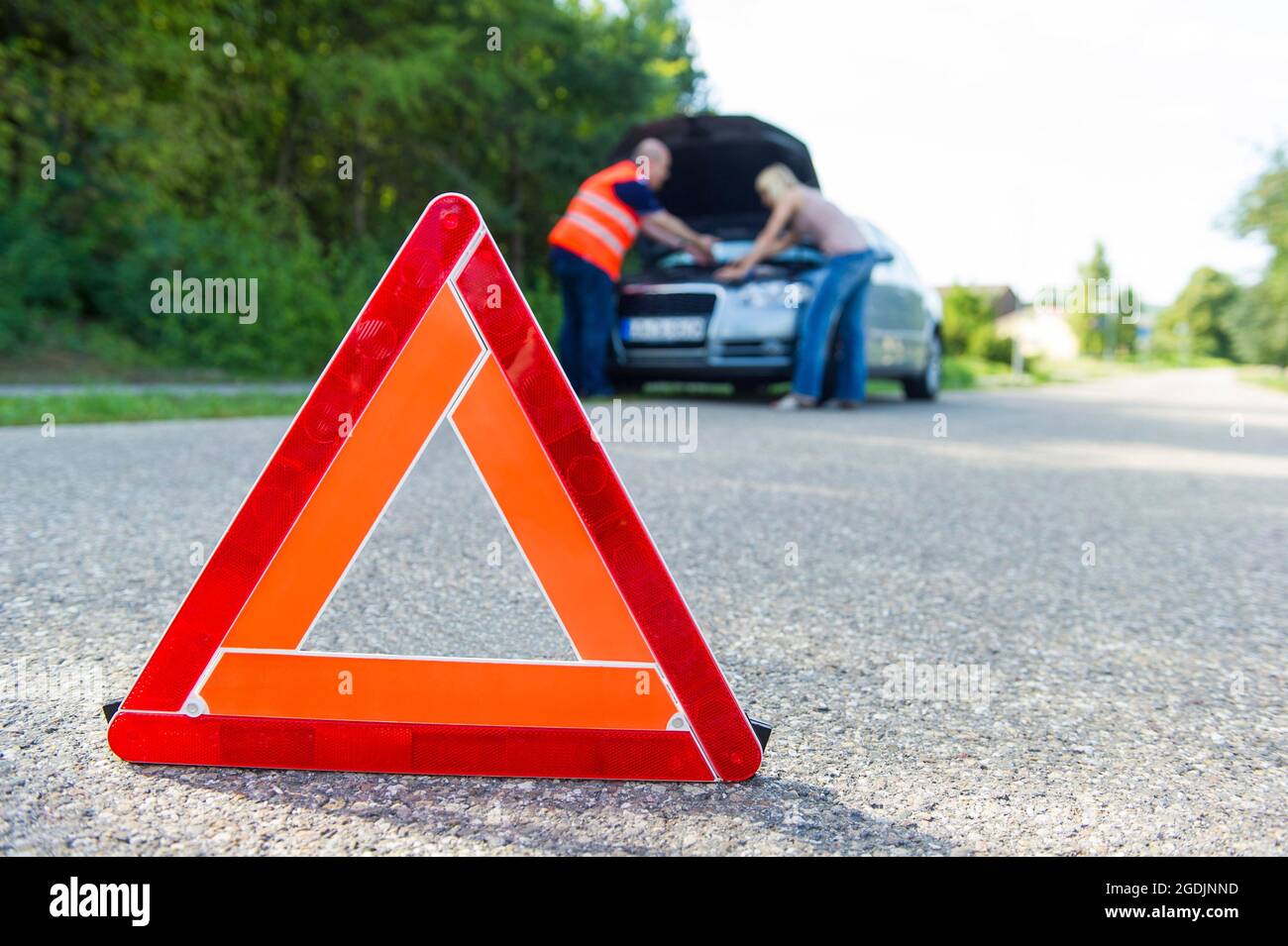 warning triangle set up because of a breakdown with a car , Germany ...