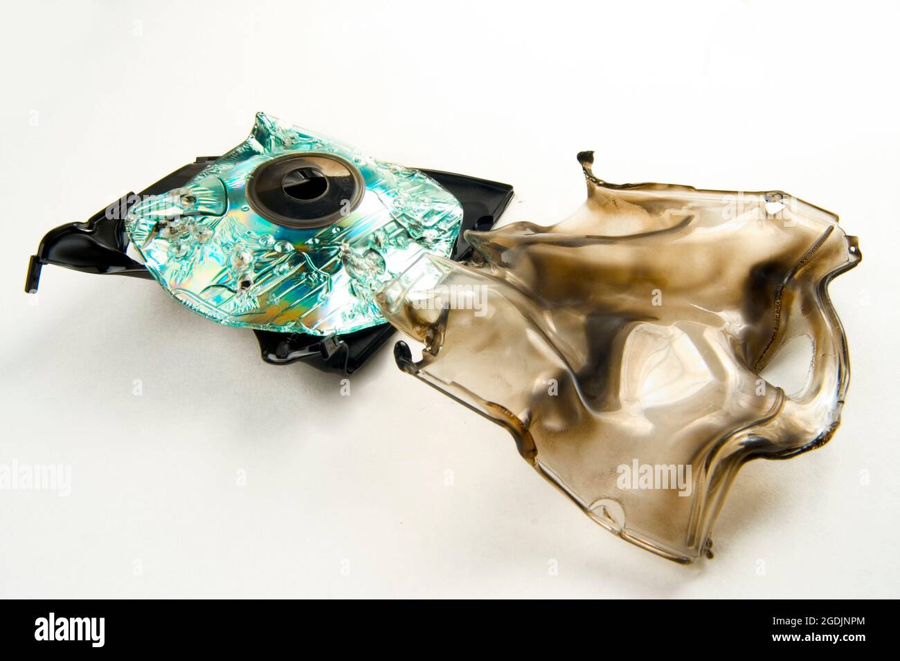 loss of data, melted CD with CD cover Stock Photo - Alamy
