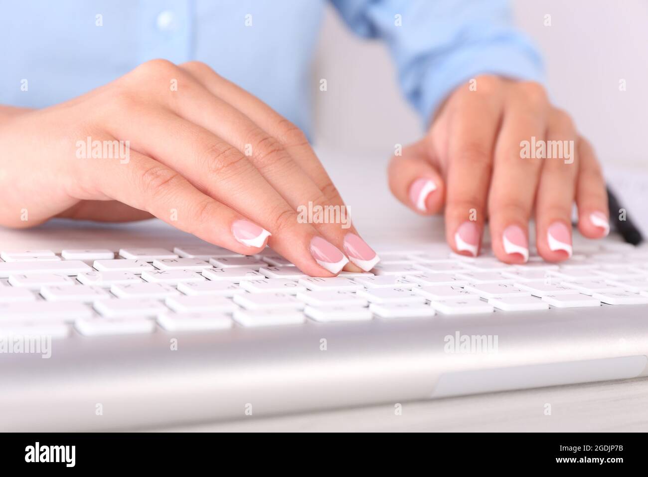 Female hands typing on keyboard, close-up, on dark background Stock ...