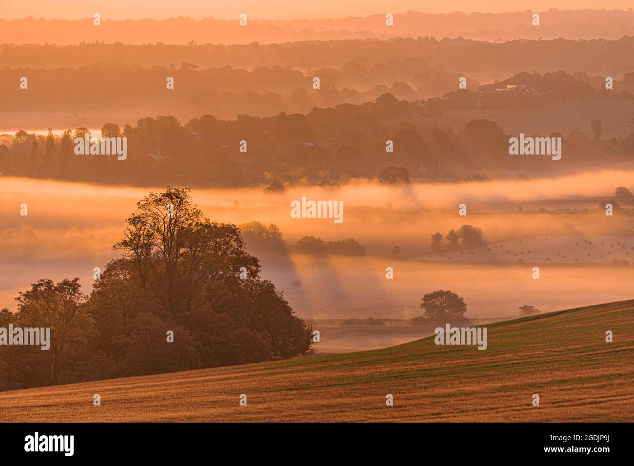 Mesmerizing landscape of sun-drenched hills Stock Photo - Alamy