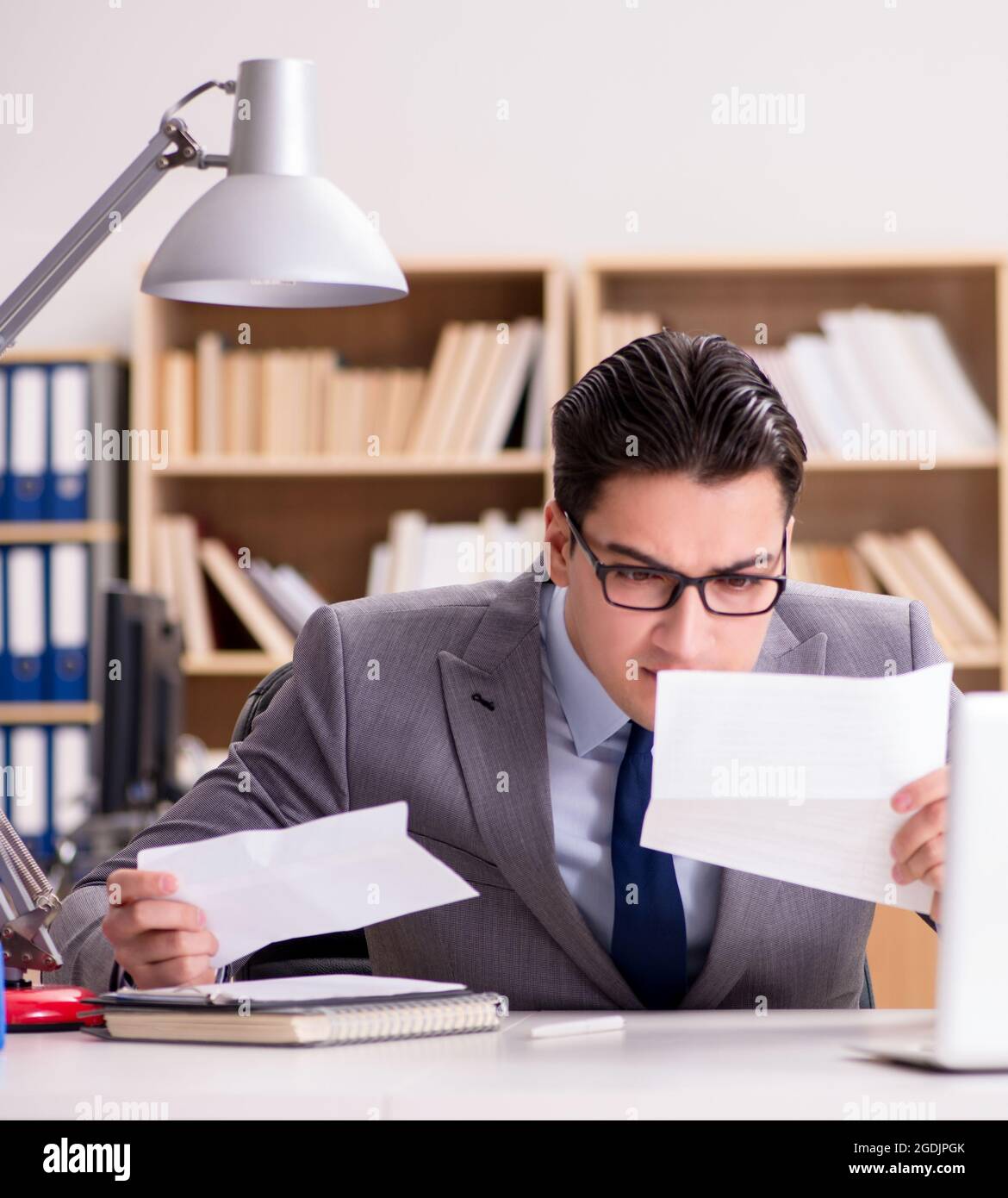 The businessman receiving letter in the office Stock Photo - Alamy