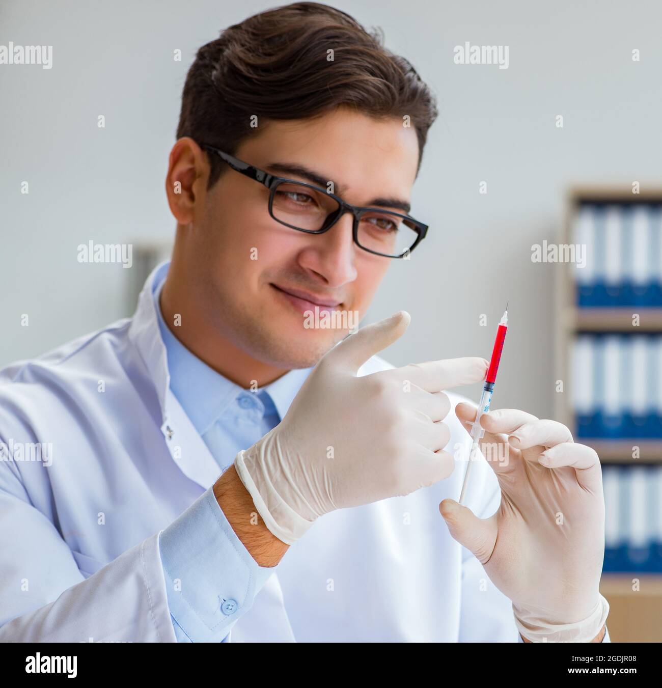 The doctor working with blood samples Stock Photo - Alamy
