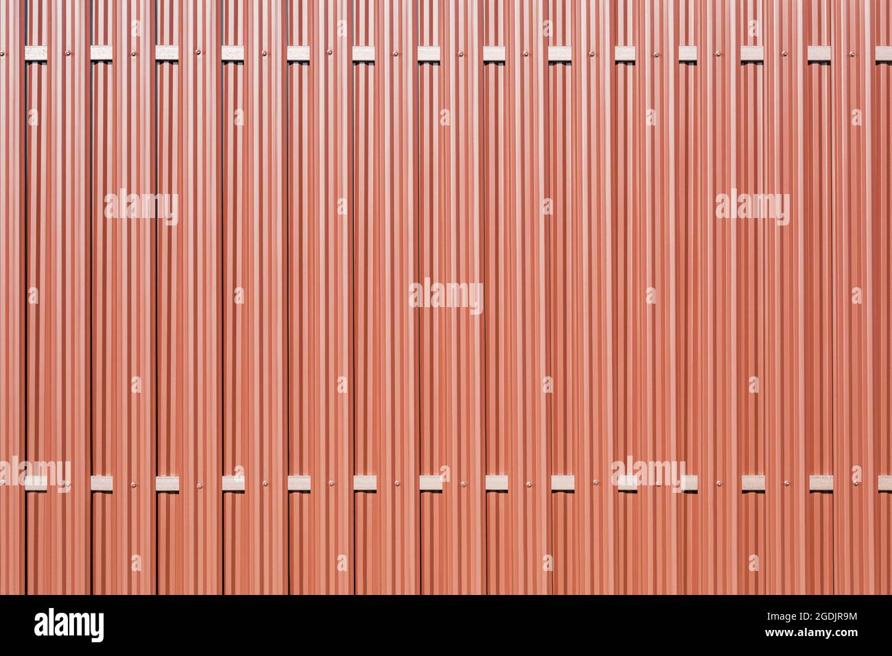 Brown metallic vertical material. Fence wall background Stock Photo - Alamy