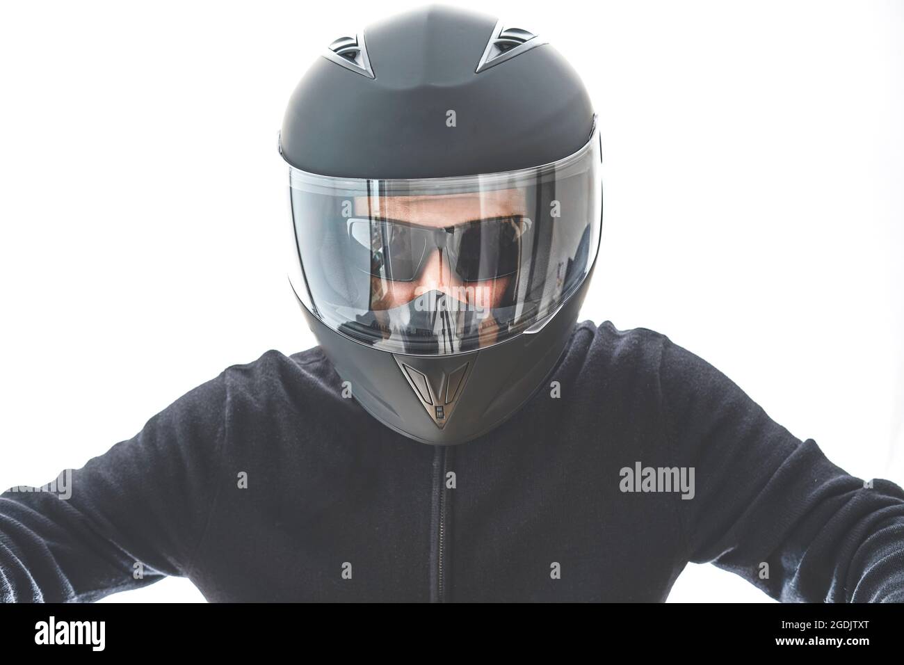 Portrait of guy with black checkered jacket and motorcycle helmet ...