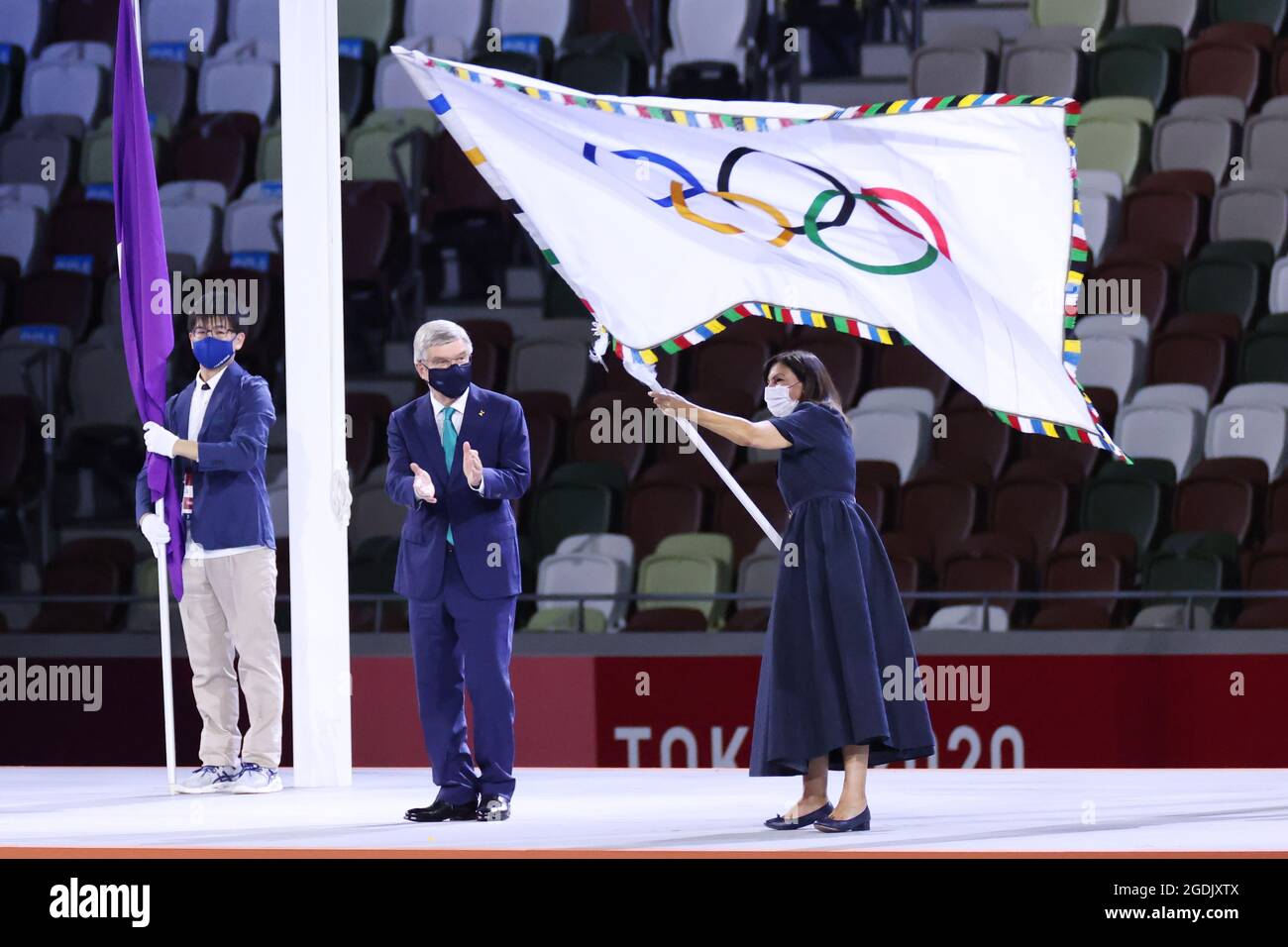 (L-R) Thomas Bach IOC President applauds as Anne Hidalgo Paris Mayor waves the Olympic flag ...