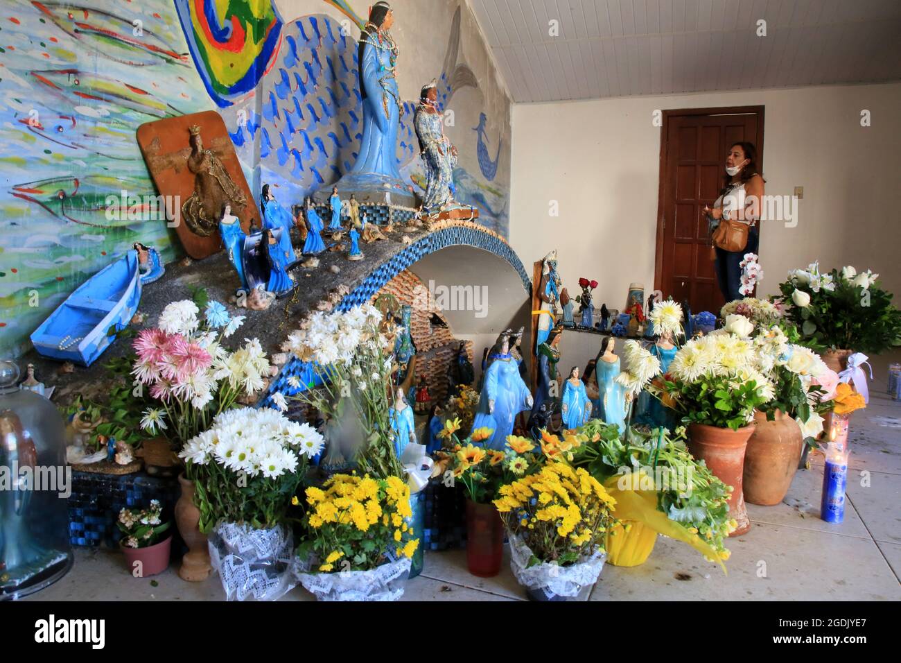 salvador, bahia, brazil - august 13, 2021: woman is seen in a shrine in ...