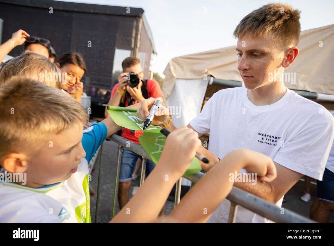 Two-time Tour de France winner Tadej Pogacar signs autographs at a ...