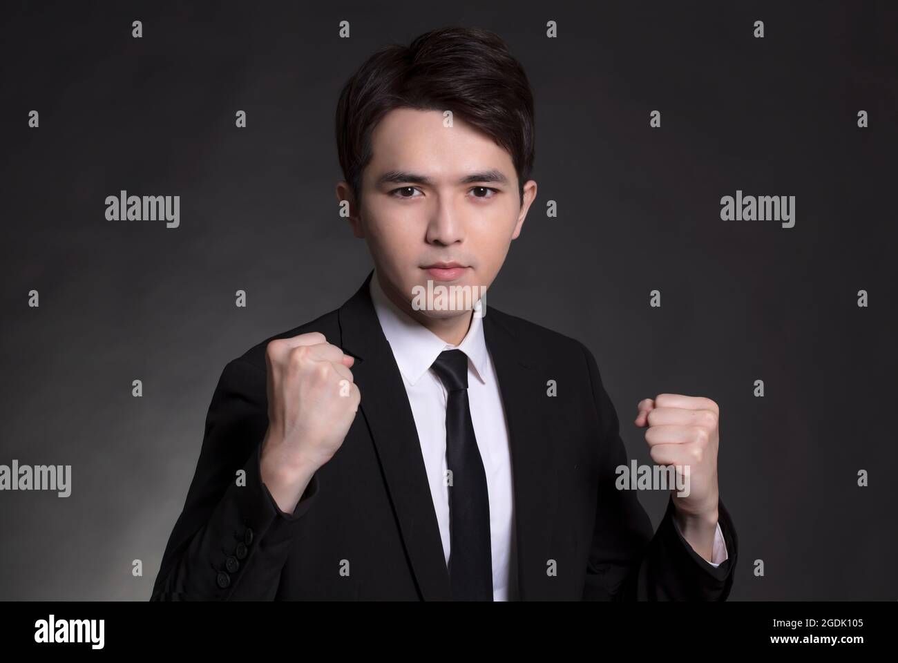 Businessman hand in black suit hi-res stock photography and images - Alamy