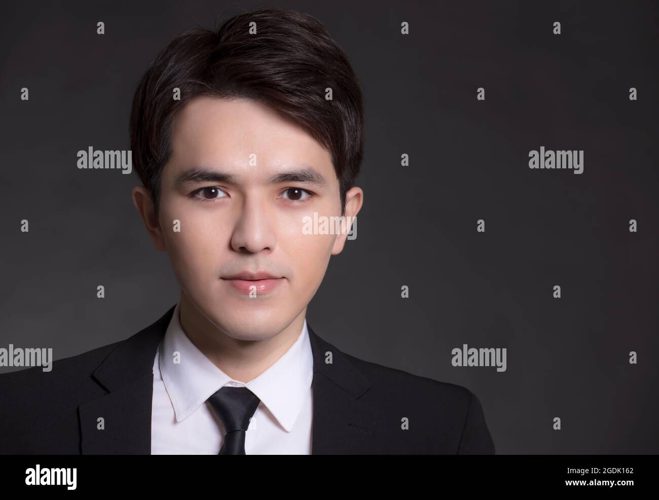 Young Asian handsome Business man in black suit Stock Photo - Alamy