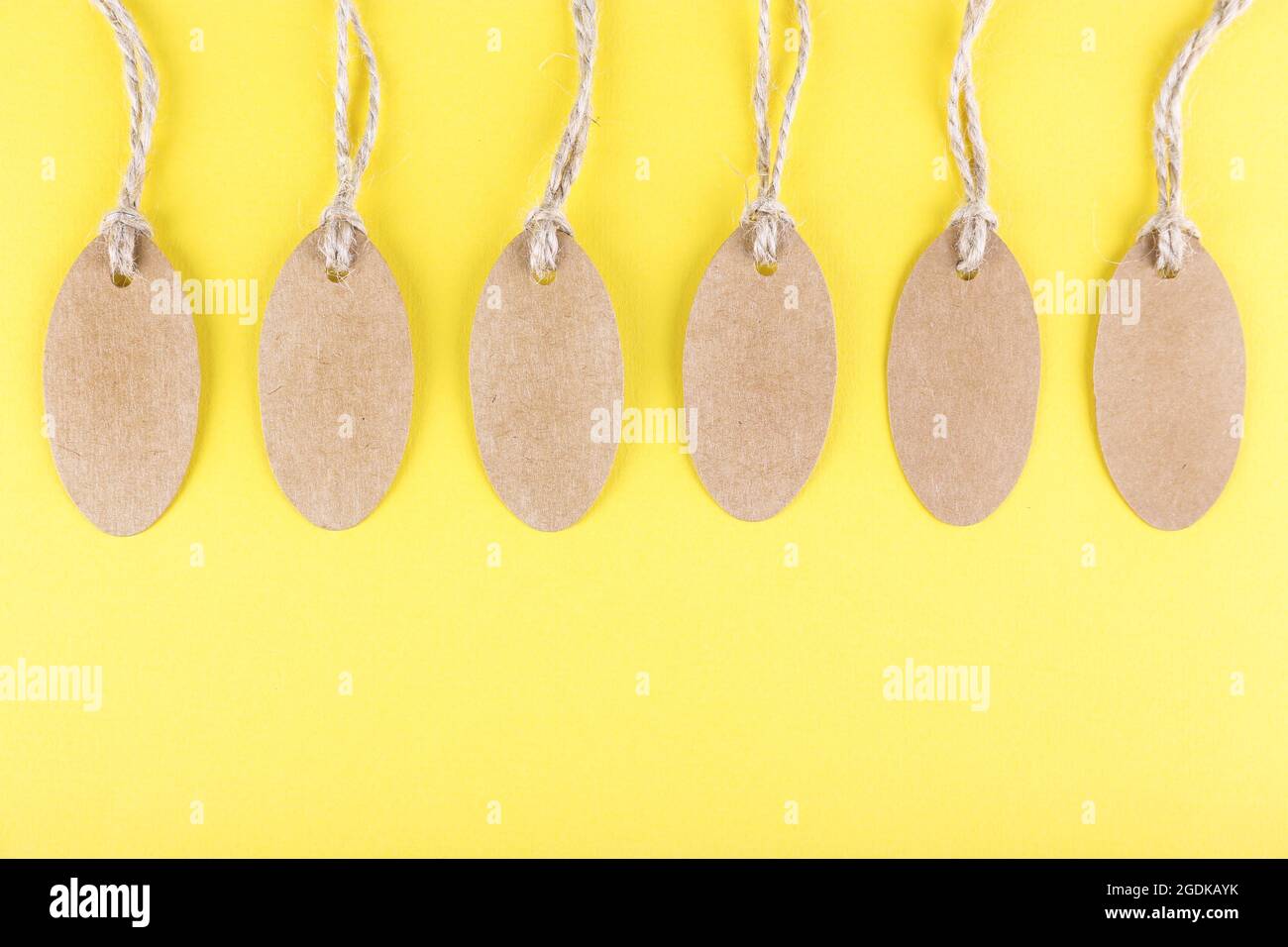 Brown tags on colorful background Stock Photo - Alamy