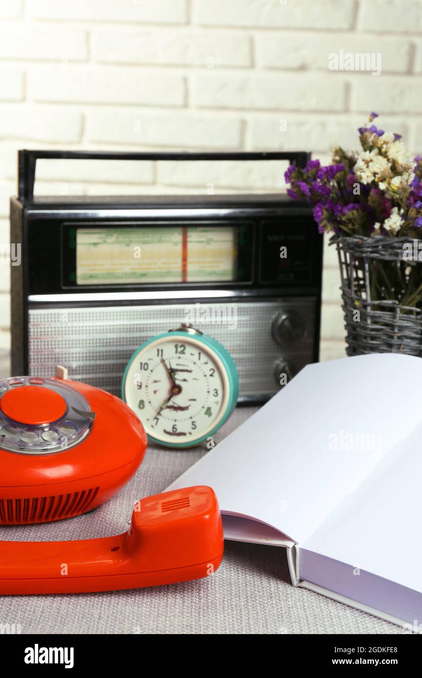 Retro composition with old phone, radio and books, close up Stock Photo ...